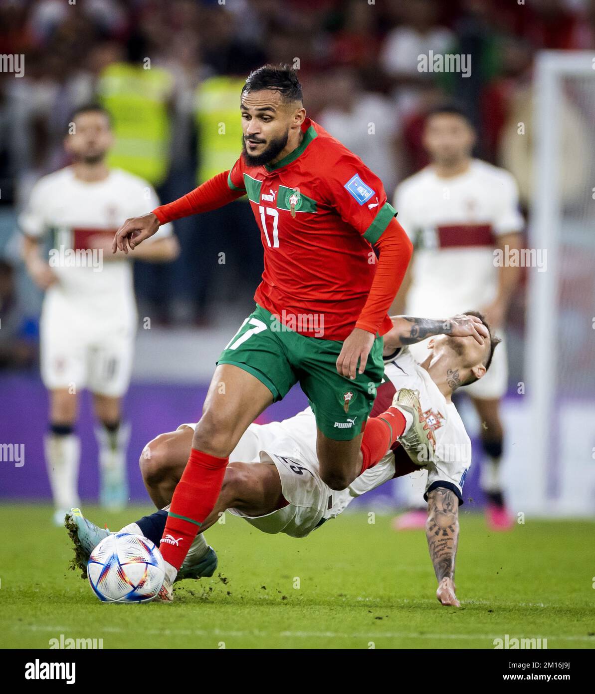 DOHA - Sofiane Boufal of Morocco and Otavio of Portugal during the FIFA World Cup Qatar 2022 ...