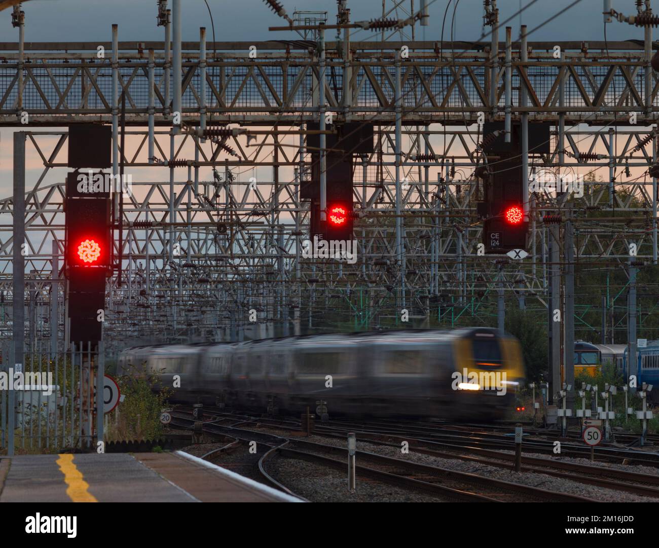 2 Avanti West Coast Class 221 Diesel Voyager Trains Passing A Signal Gantry And Red Signals On 