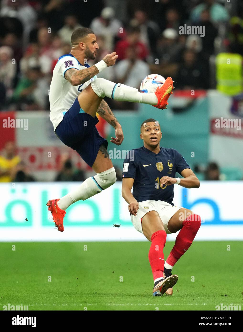 England's Kyle Walker (left) and France's Kylian Mbappe in action ...