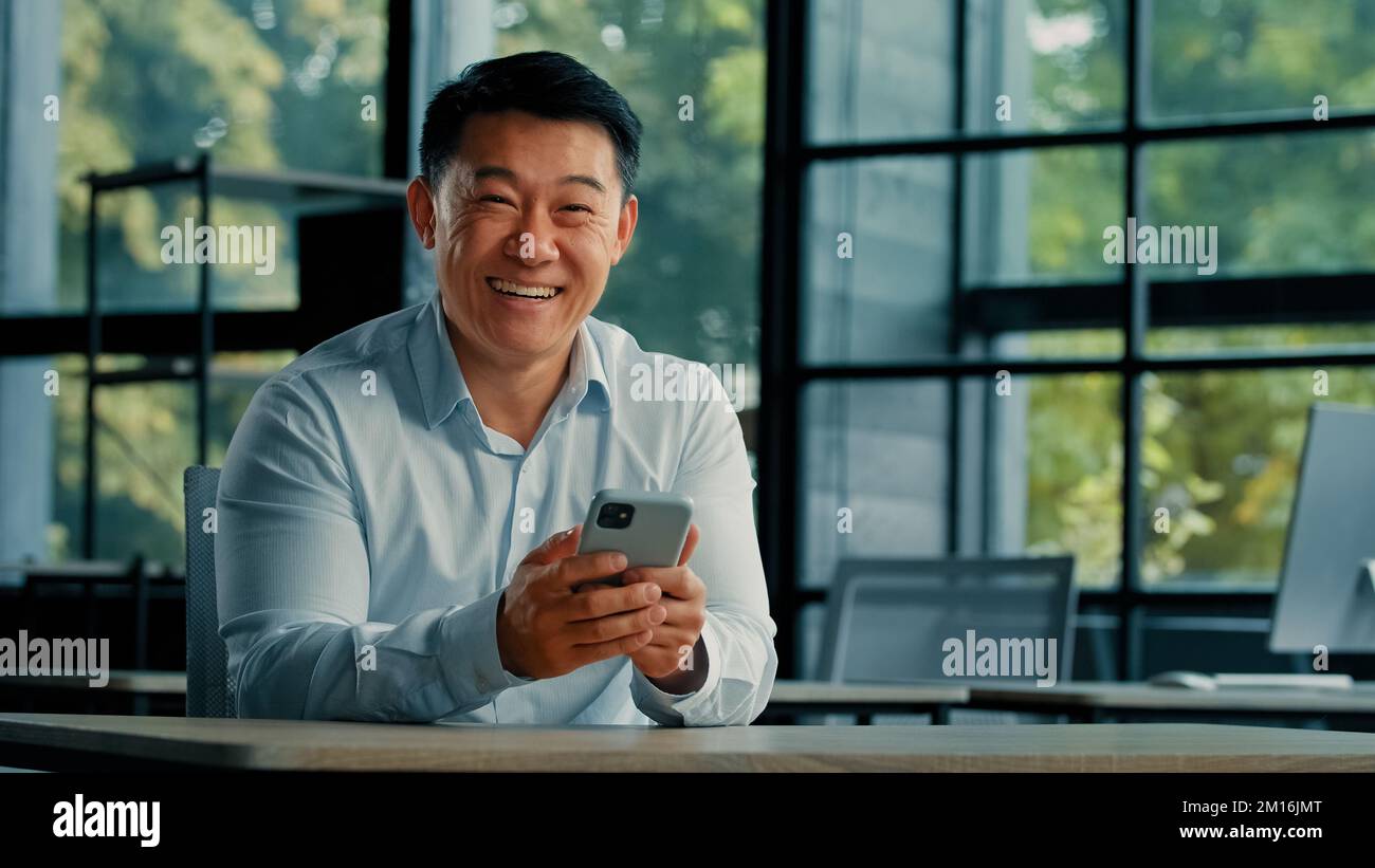 Surprised Asian successful businessman emotional man professional ...