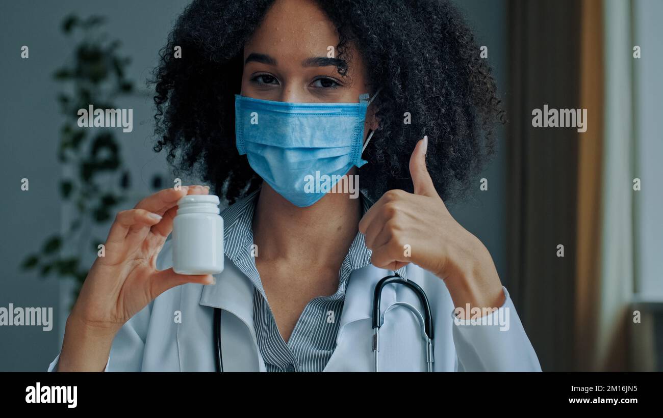 African doctor woman in mask cardiologist pharmacist adviser show at ...