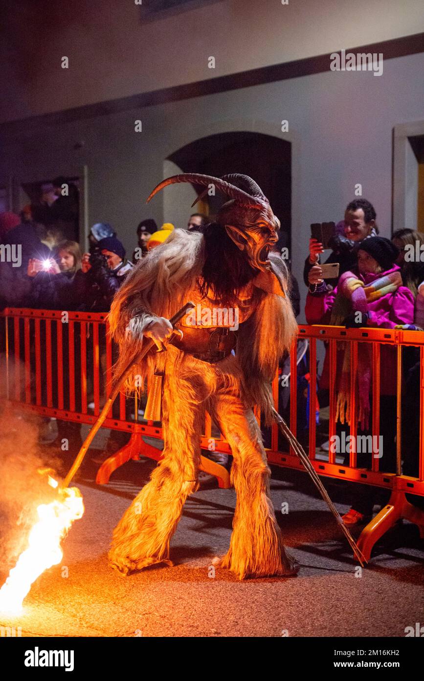 Masked devil beasts parade through the village scaring the crowd while ...