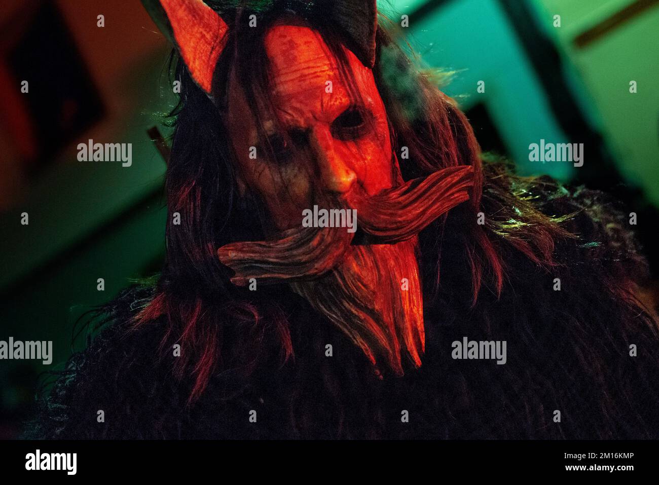 Masked devil beasts parade through the village scaring the crowd while ...