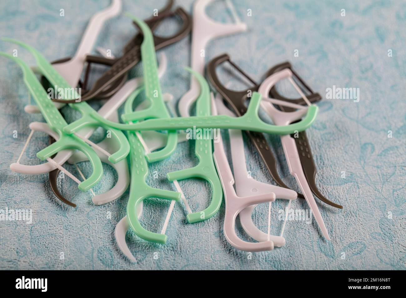 Colorful toothpick. Assorted colors dental floss pick on the color ...