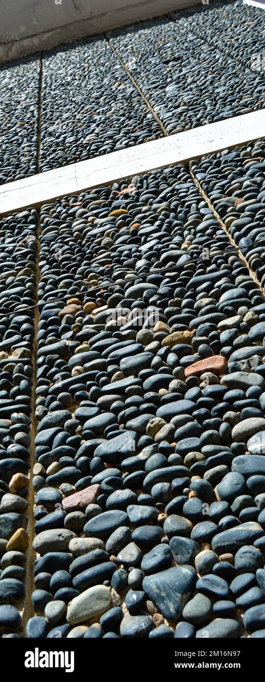 Wall texture decorated with blue pebbles, pebbles glued to the wall ...