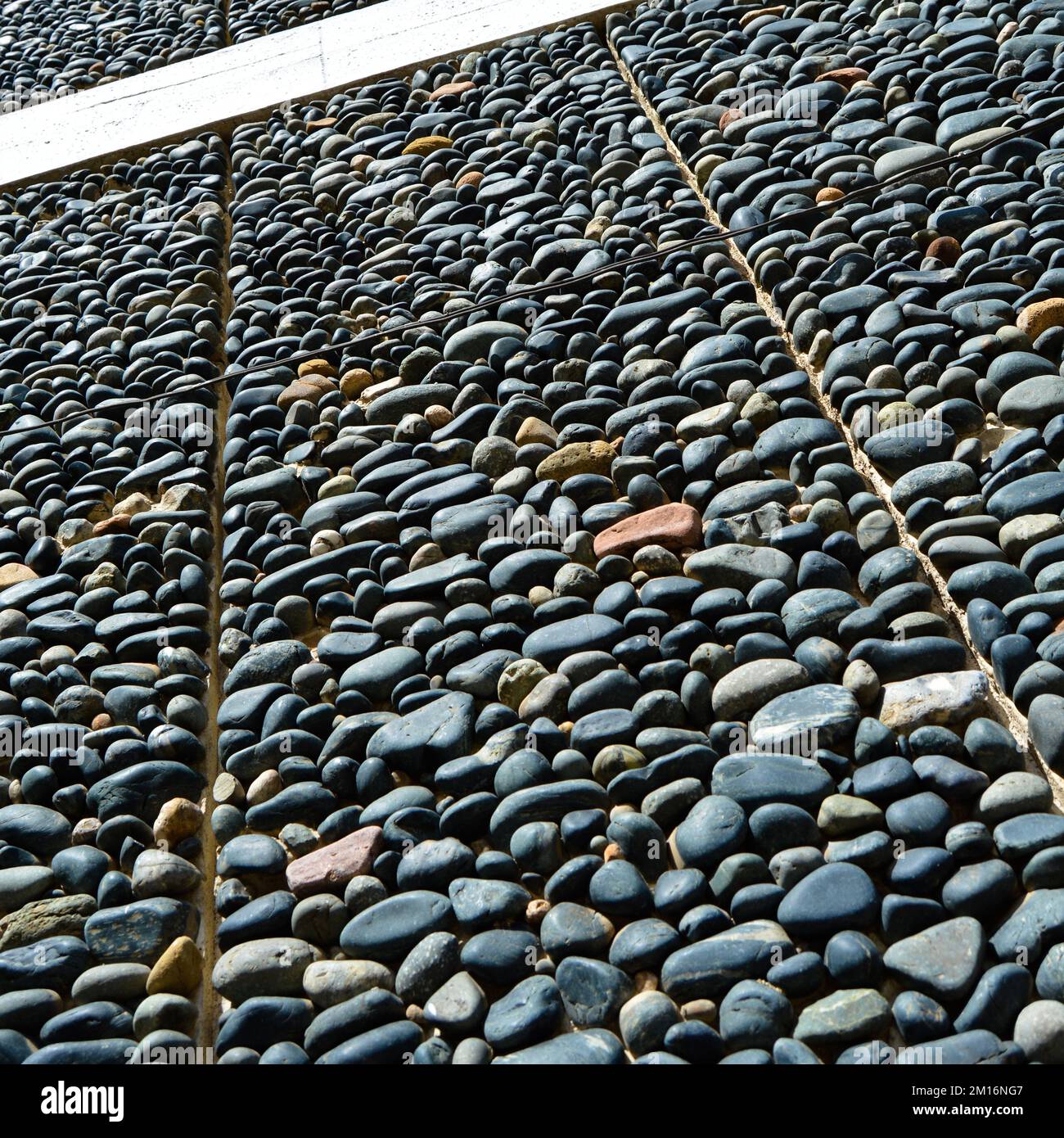 Wall texture decorated with blue pebbles, pebbles glued to the wall ...