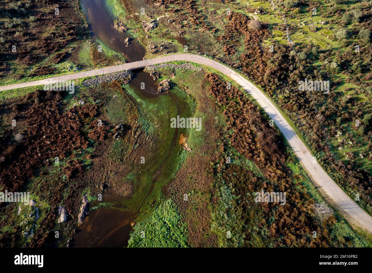 Aerial view in with stream and country road Stock Photo - Alamy