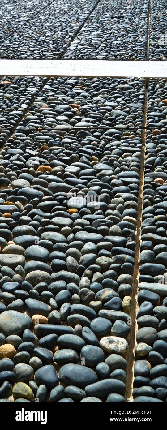 Wall texture decorated with blue pebbles, pebbles glued to the wall ...