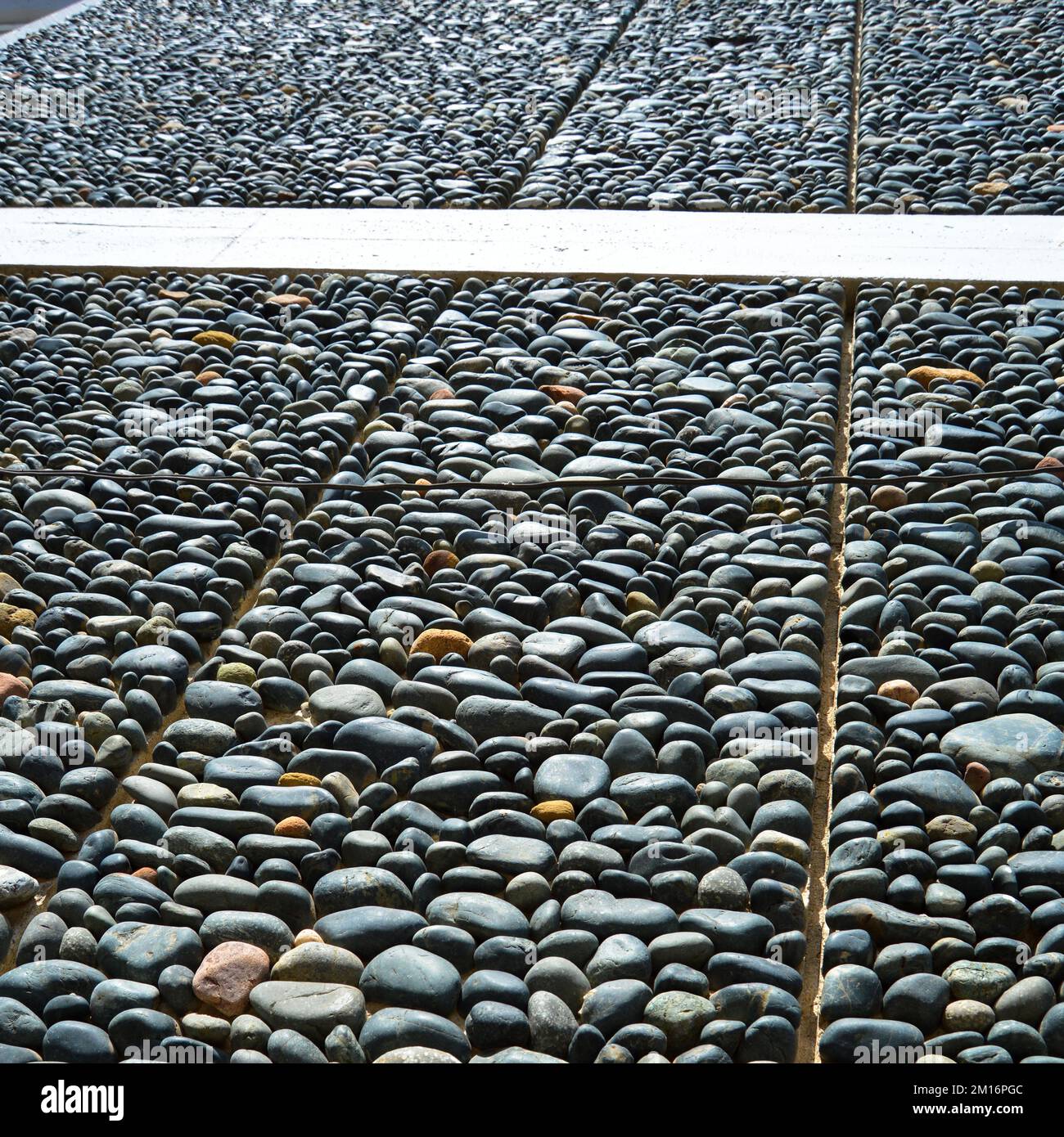 Wall texture decorated with blue pebbles, pebbles glued to the wall ...