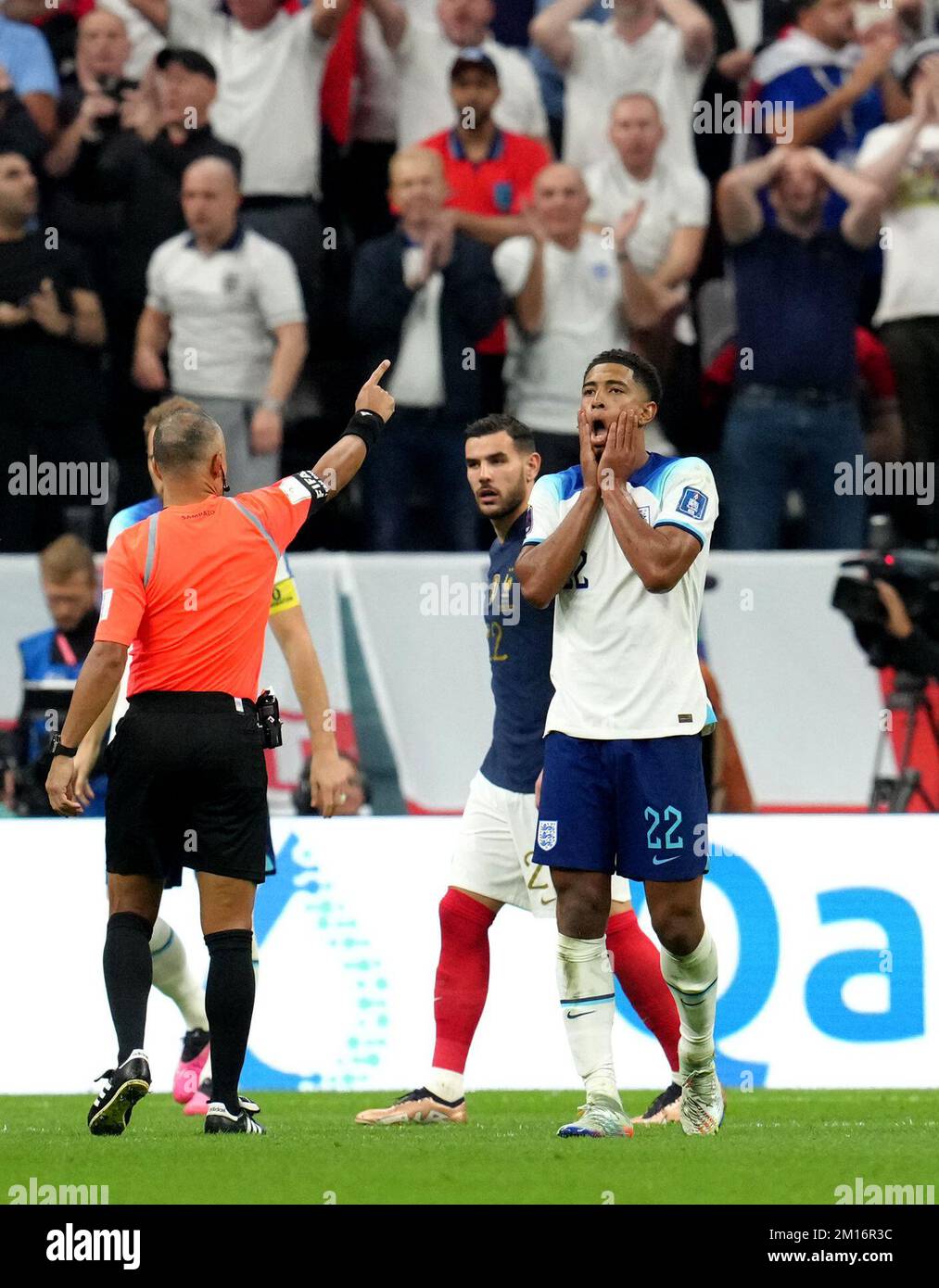 England's Jude Bellingham (centre) is dejected after his shot is saved ...