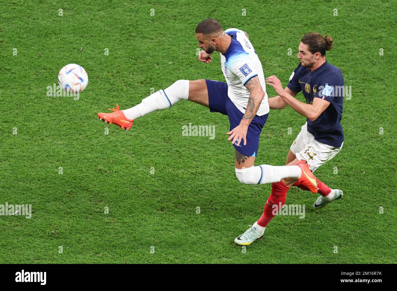 Al Khor, Qatar. 10th Dec, 2022. Kyle Walker (L) of England vies with ...