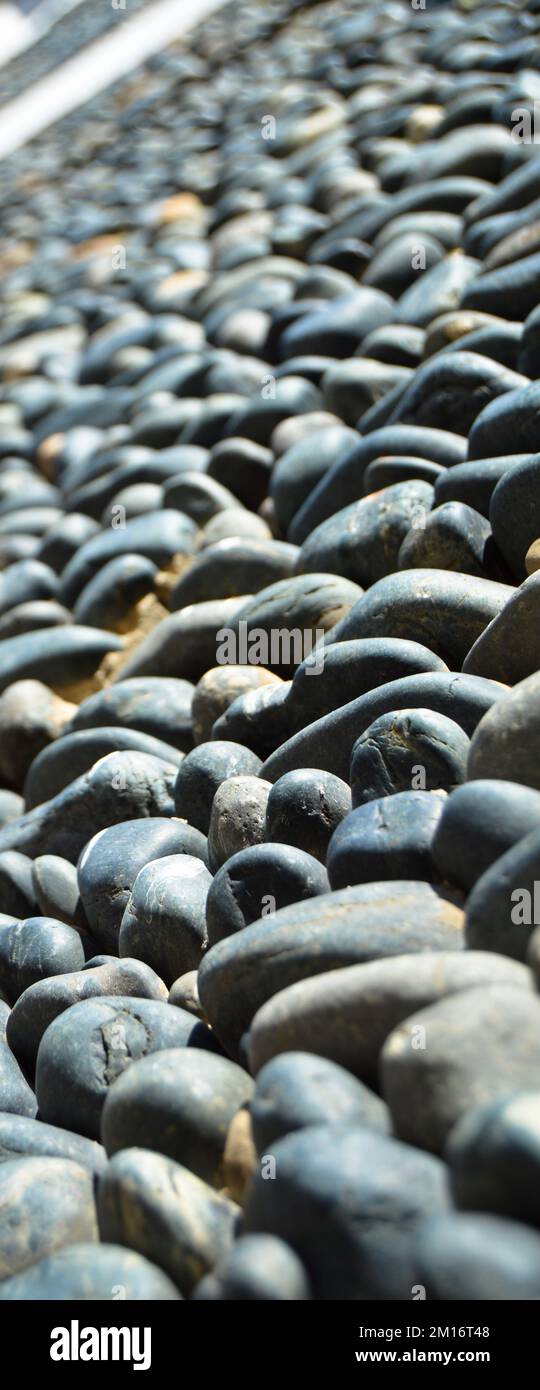 Wall texture decorated with blue pebbles, pebbles glued to the wall ...