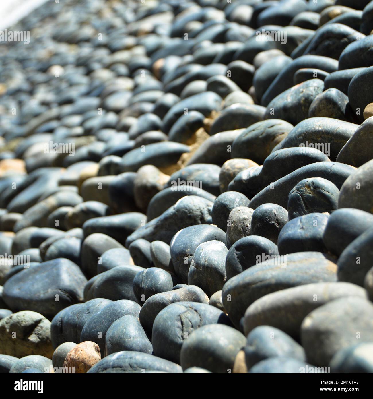 Wall texture decorated with blue pebbles, pebbles glued to the wall ...