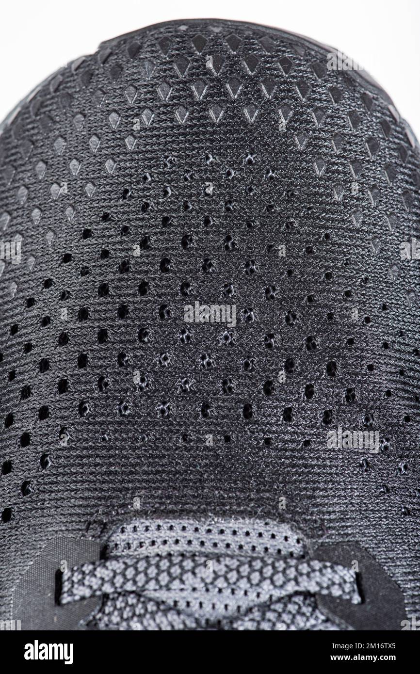 Mesh fabric of sports shoes in gray color. Shoes made of mesh fabric ...