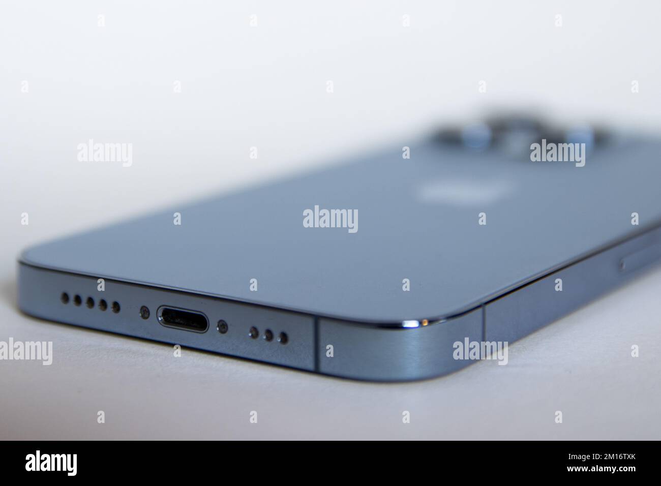 A close-up shot of a blue iPhone 13 Pro charging port Stock Photo - Alamy