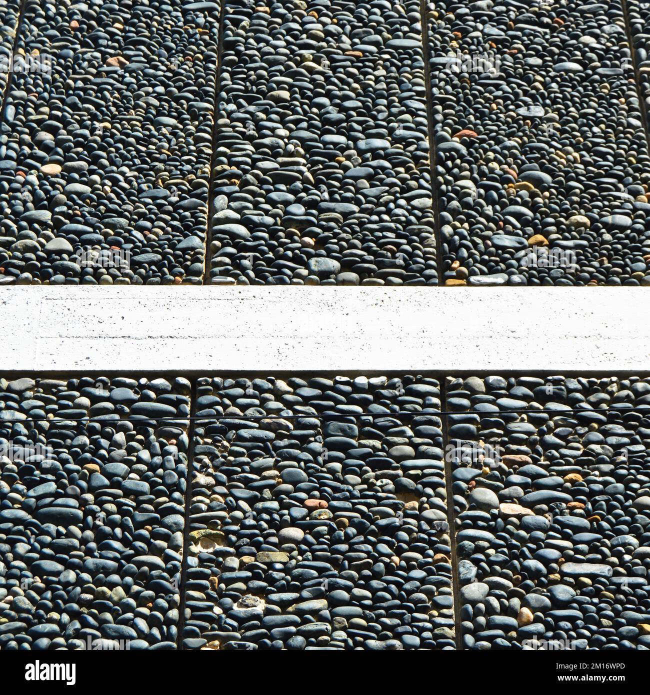 Wall texture decorated with blue pebbles, pebbles glued to the wall ...