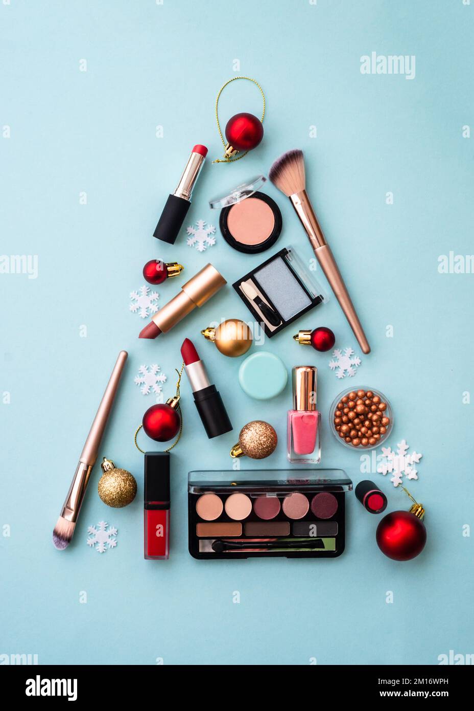 Christmas tree made from cosmetic and make up products on blue Stock ...