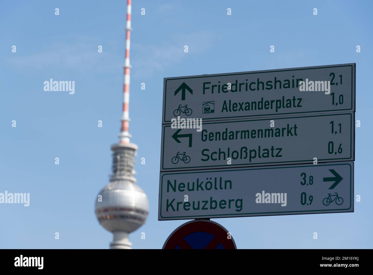 A closeup shot of a street sign showing directions to Alexanderplatz ...