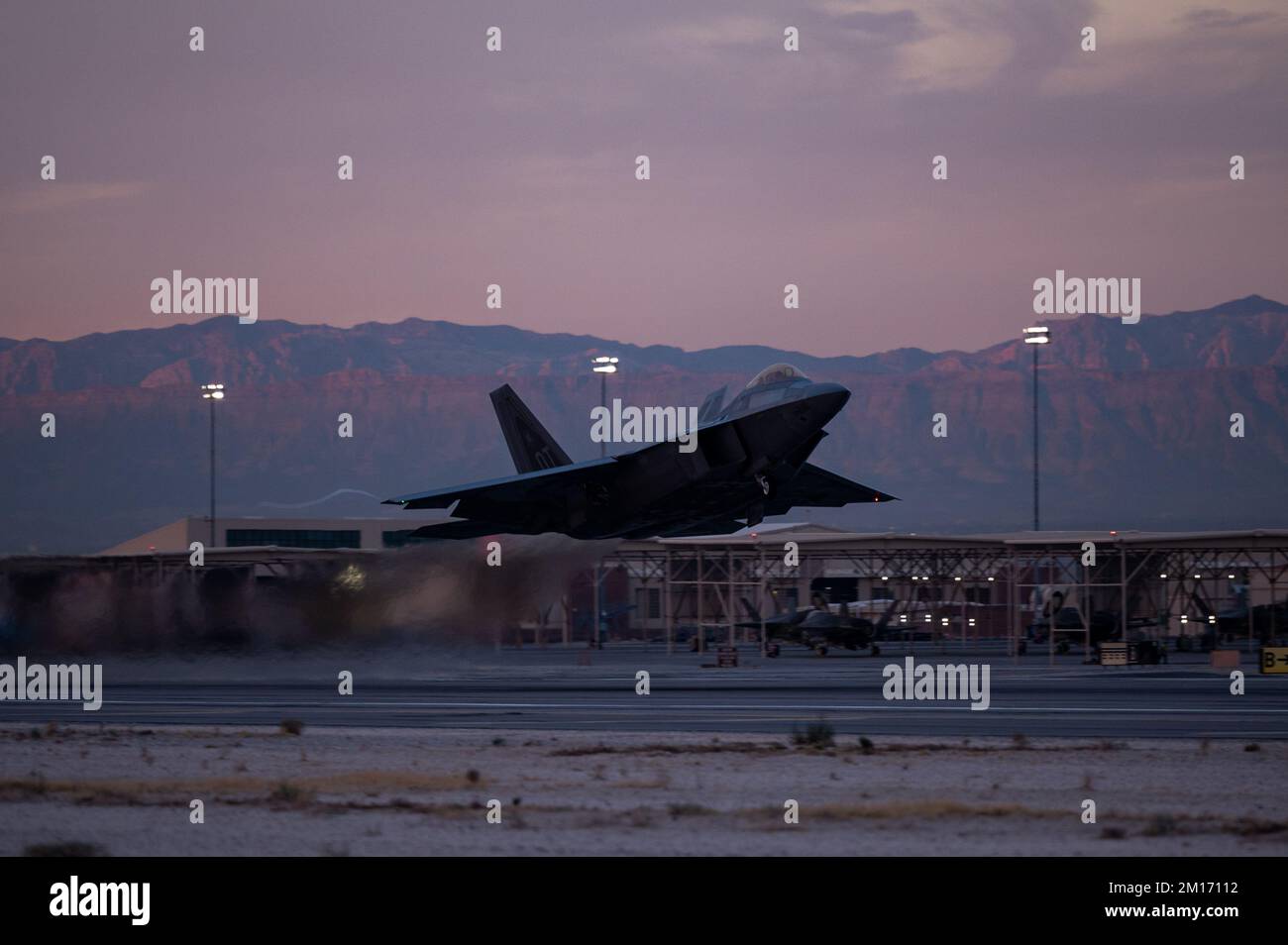 An F-22, assigned to the 422nd Test and Evaluation Squadron, takes off ...