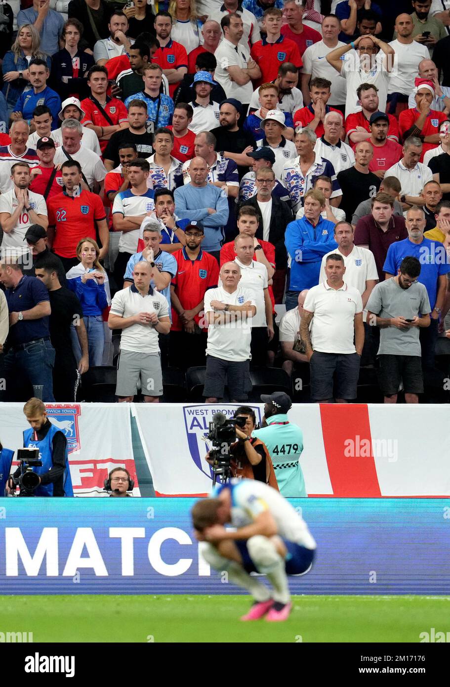 England's fans look on at the end of the match as Harry Kane is ...