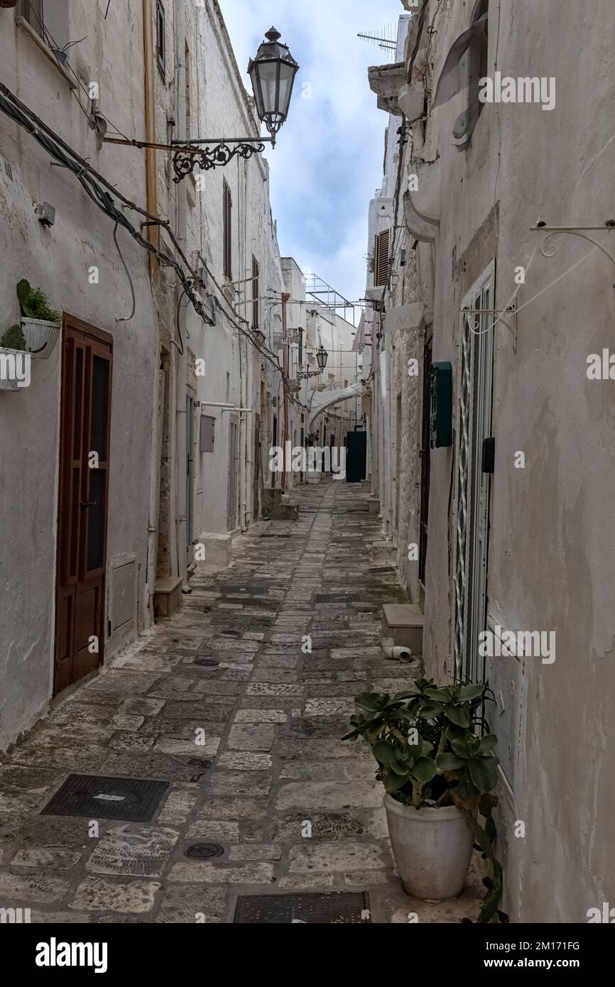 OSTUNI, ITALY - OCTOBER 18, 2022: View along narrow street in the old ...