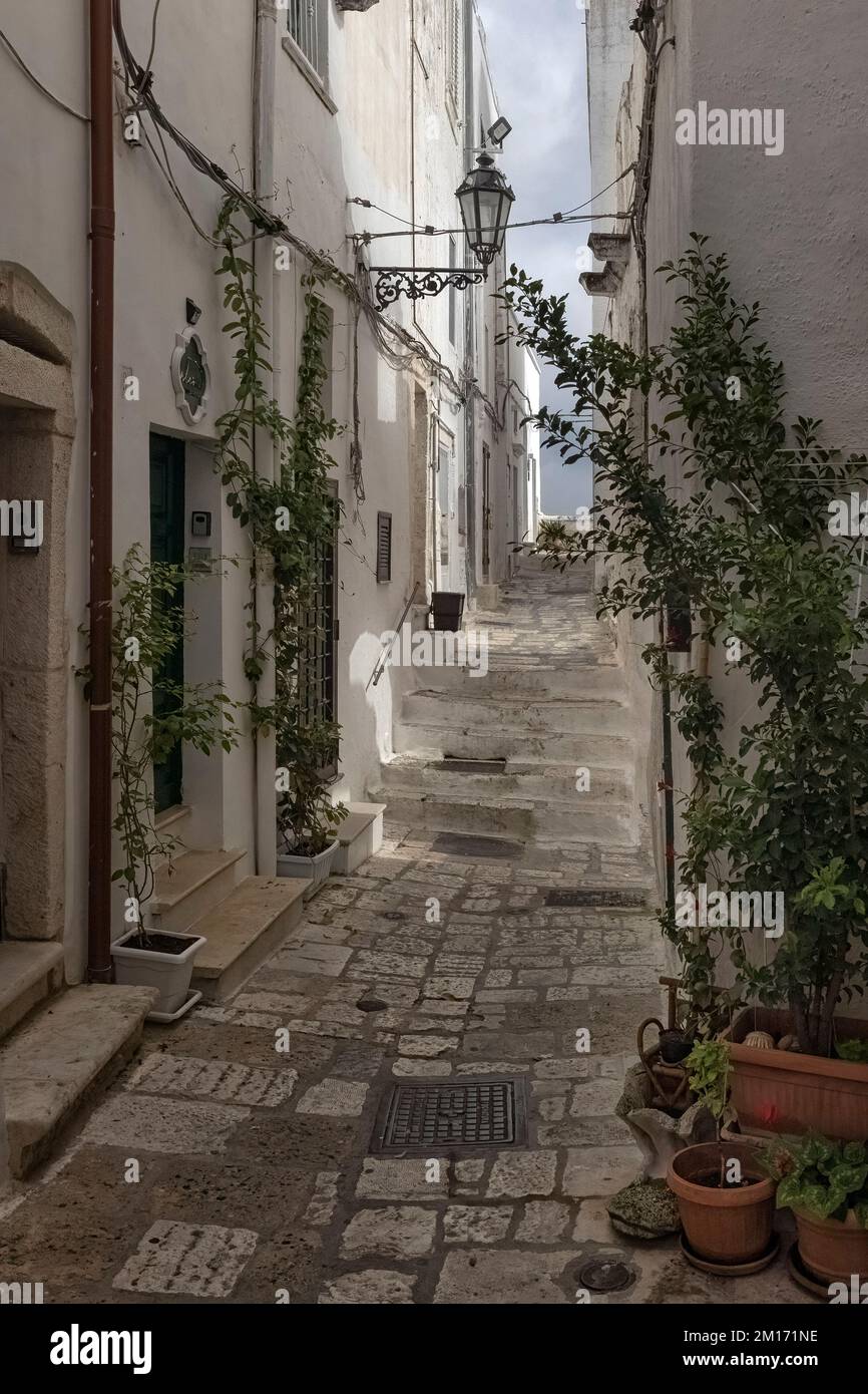 OSTUNI, ITALY - OCTOBER 18, 2022: View along narrow street in the old ...