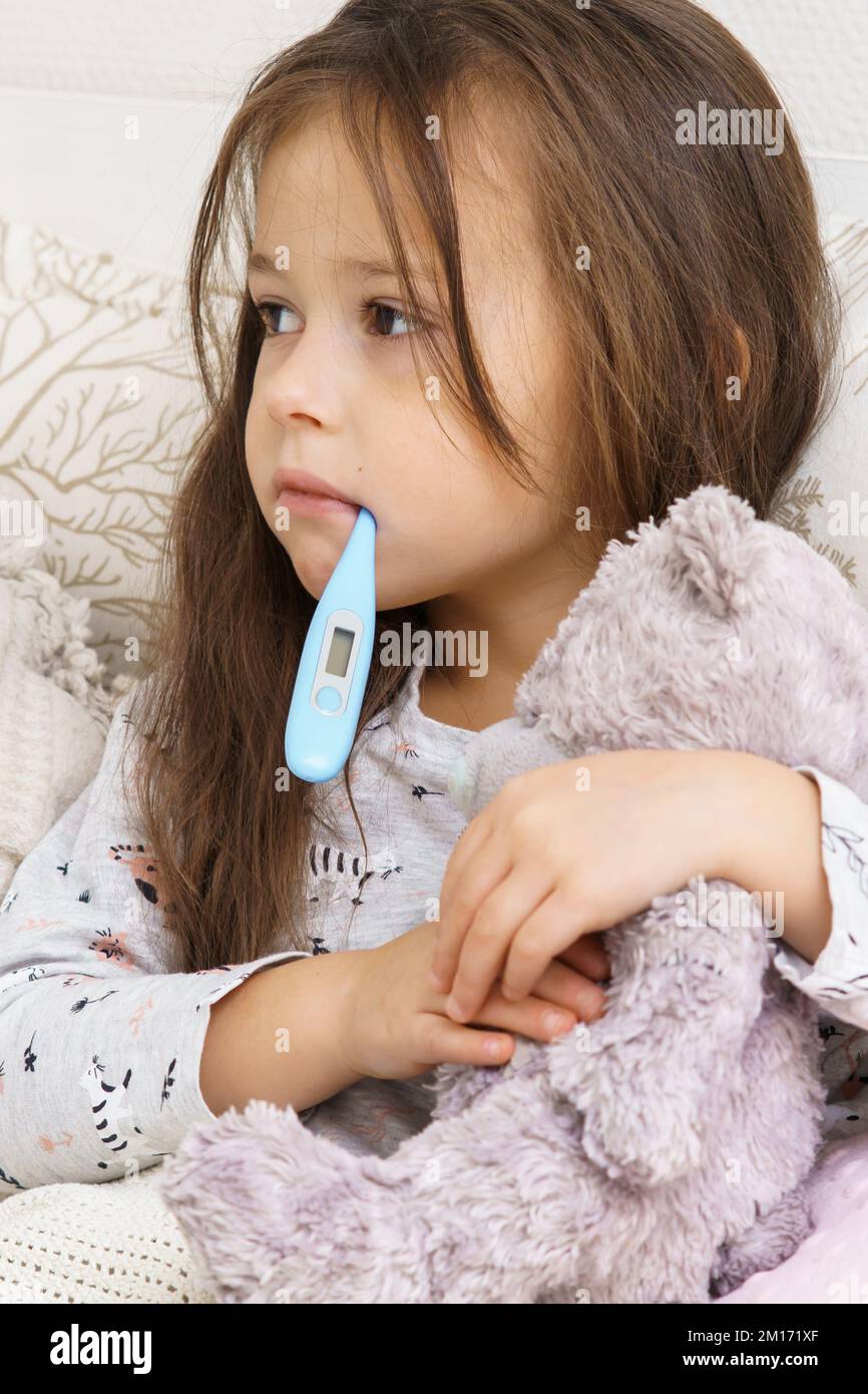 Vertical sad, calm. depressed, tired little child, girl looking away ...