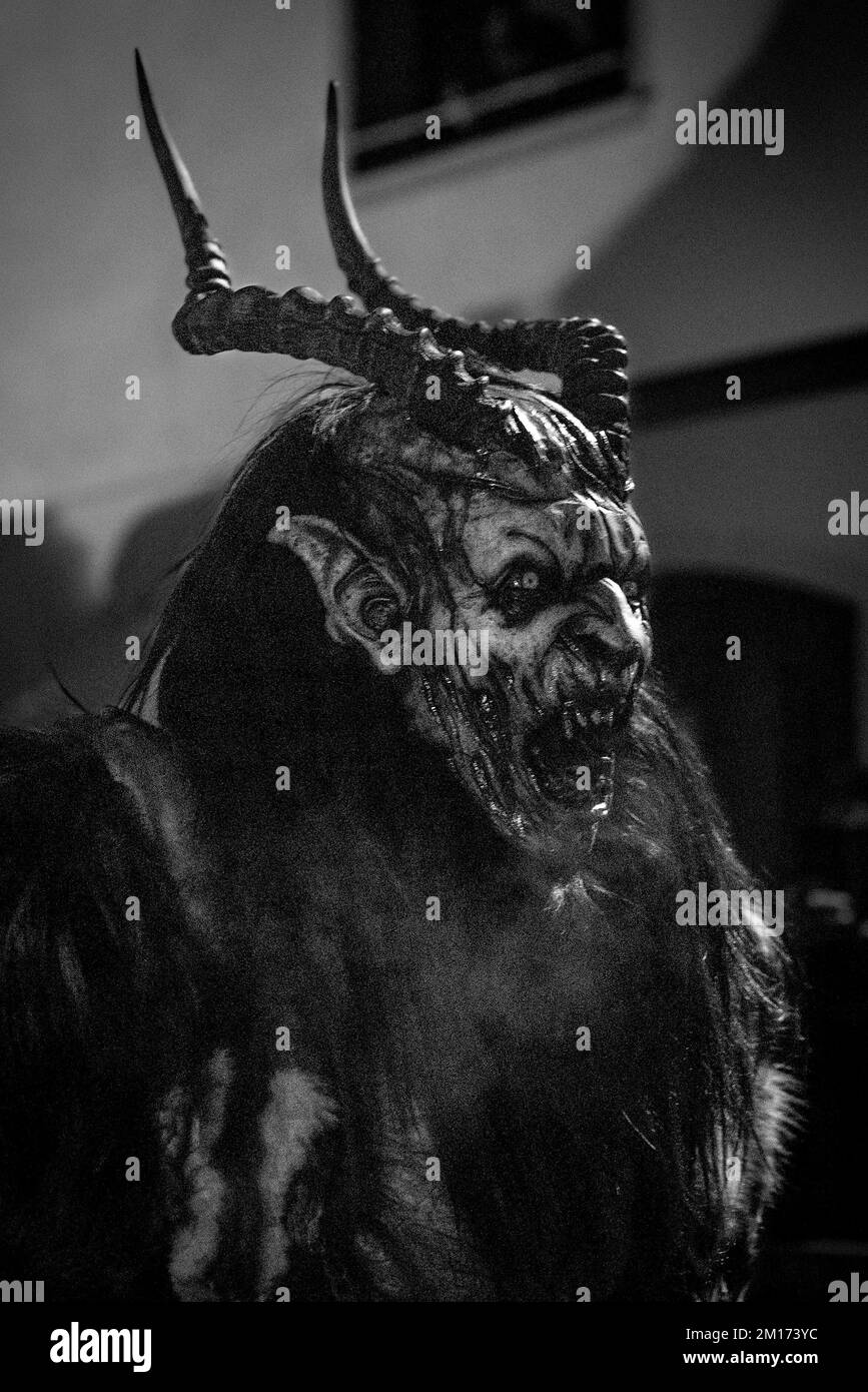 Masked devil beasts parade through the village scaring the crowd while ...