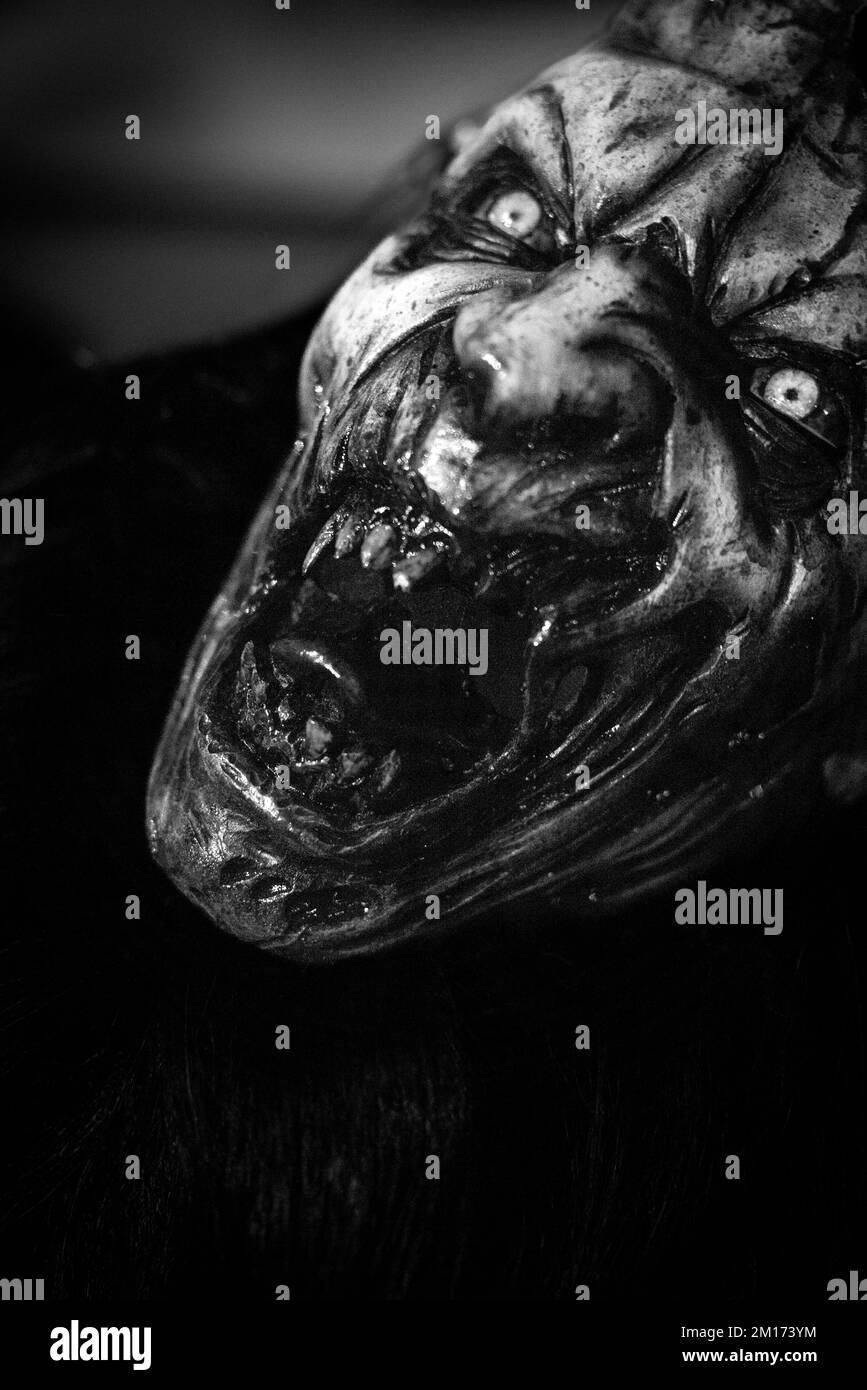 Masked devil beasts parade through the village scaring the crowd while ...