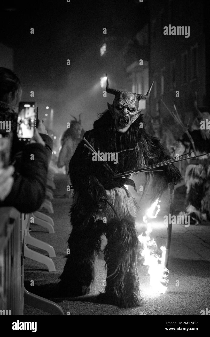 Masked devil beasts parade through the village scaring the crowd while ...