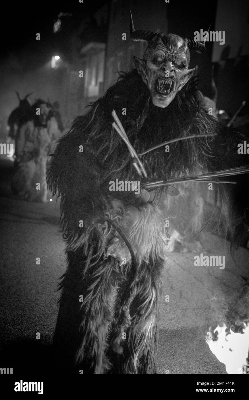 Masked devil beasts parade through the village scaring the crowd while ...