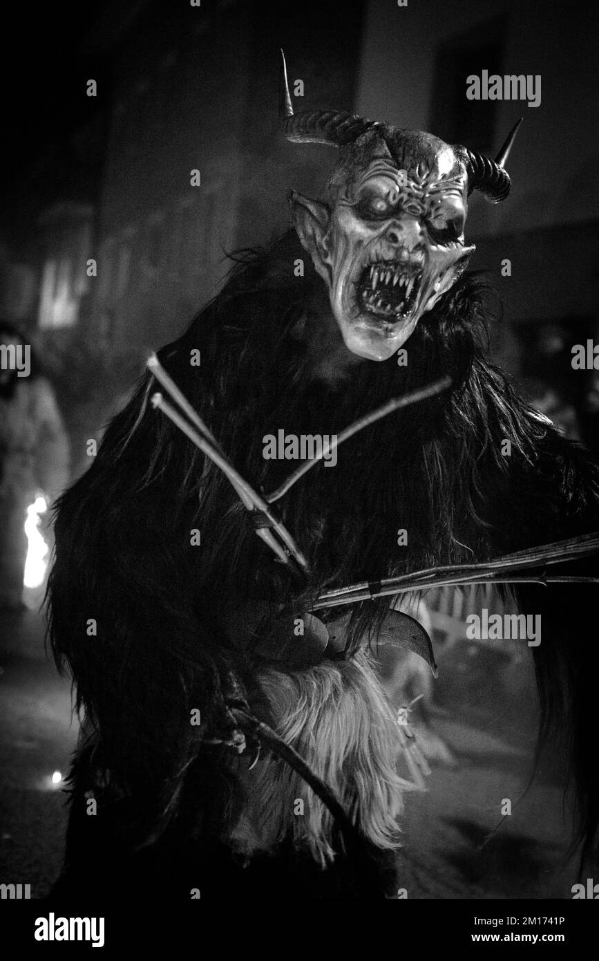 Masked devil beasts parade through the village scaring the crowd while ...