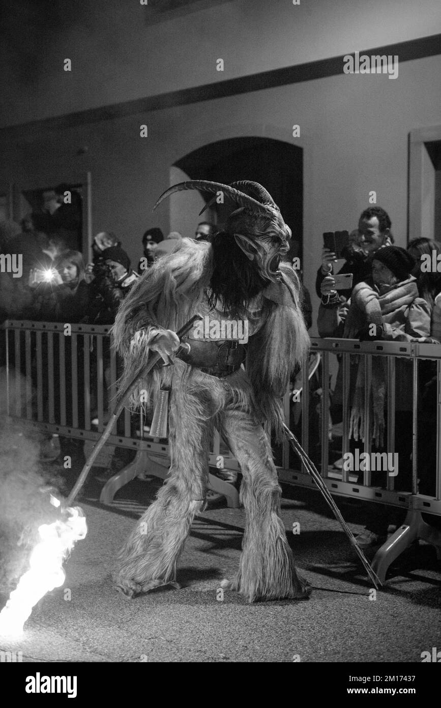 Masked devil beasts parade through the village scaring the crowd while ...