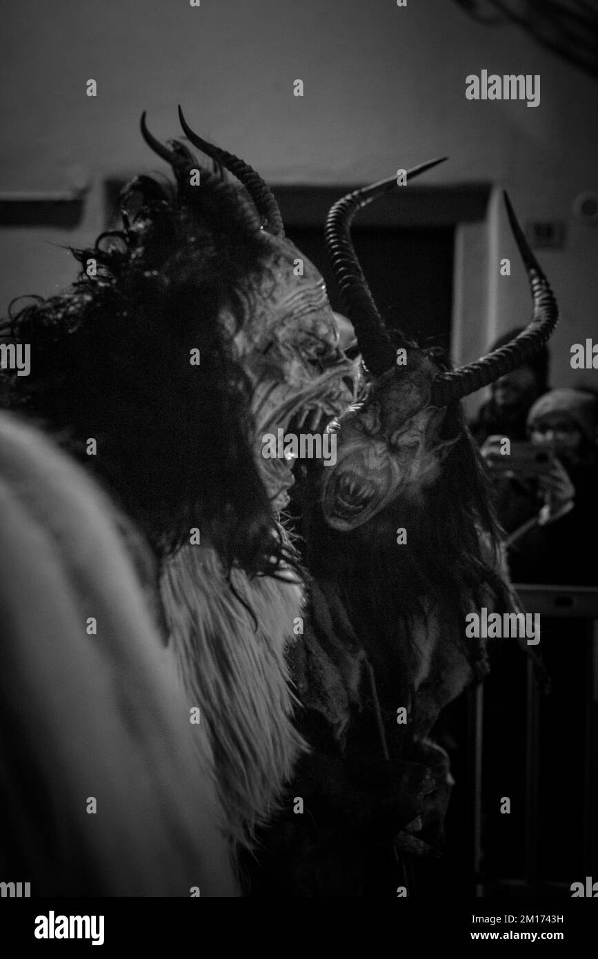 Masked devil beasts parade through the village scaring the crowd while ...