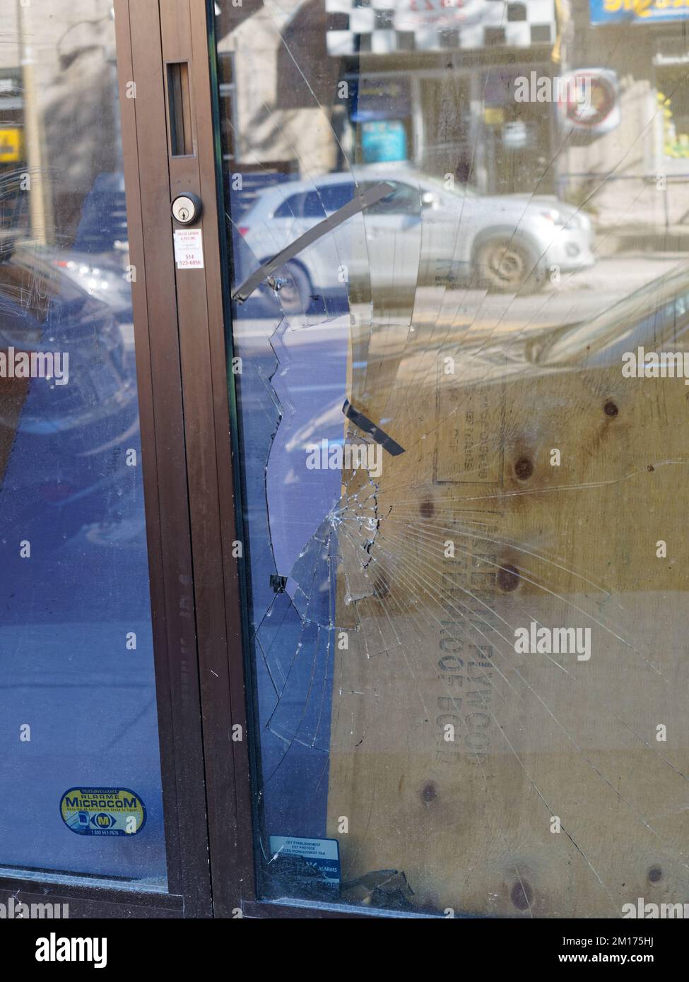 Broken glass store door. Montreal,Quebec,Canada Stock Photo - Alamy