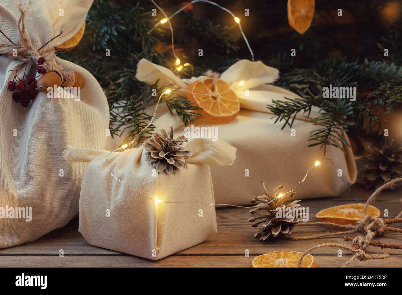 Zero waste christmas concept. Packed in natural fabric gifts and ...