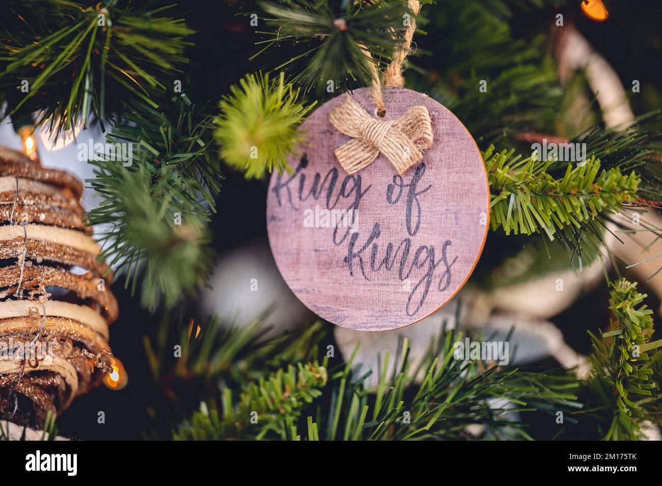 A cute wooden Christmas ornament with "king of kings" writing Stock ...