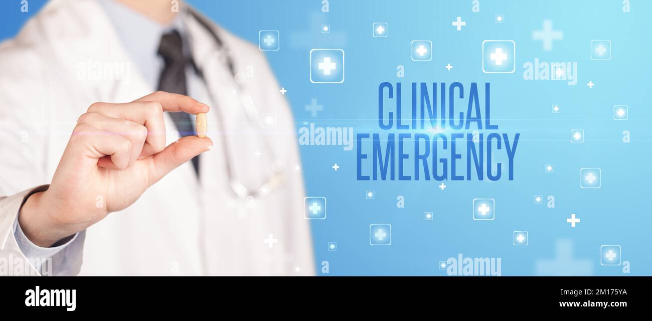 Close-up of a doctor giving a pill Stock Photo - Alamy