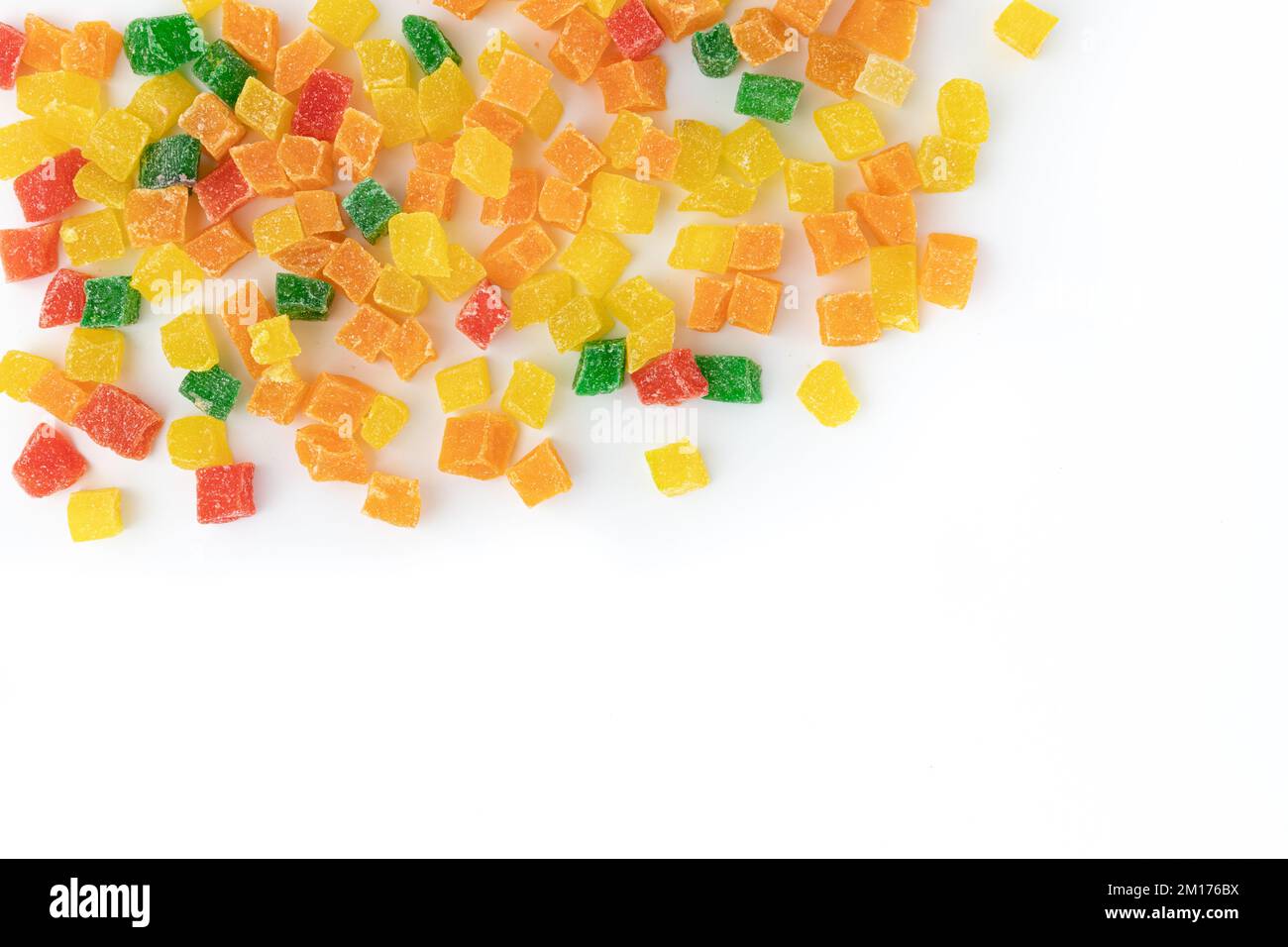 heap of candied fruit pieces close up isolated on white background ...