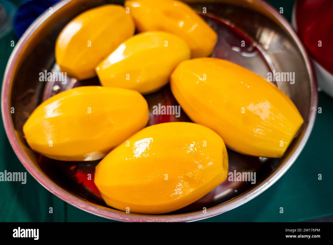 Mango, a photo of fresh yellow mango pile on market table. Ripe ...