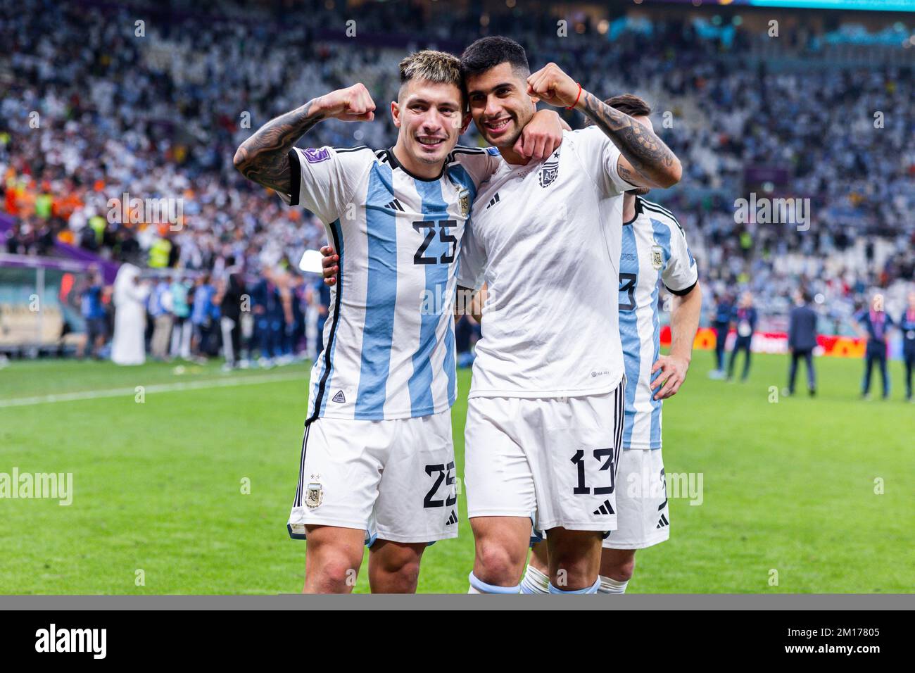 LUSAIL, - DECEMBER 09: - Argentina defenders Lisandro Martinez and ...