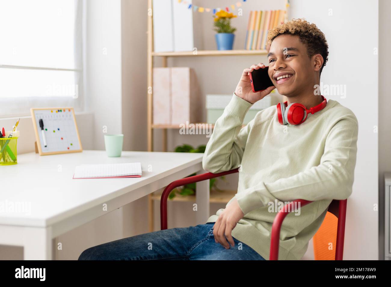 Teen boy talk phone desk hi-res stock photography and images - Alamy