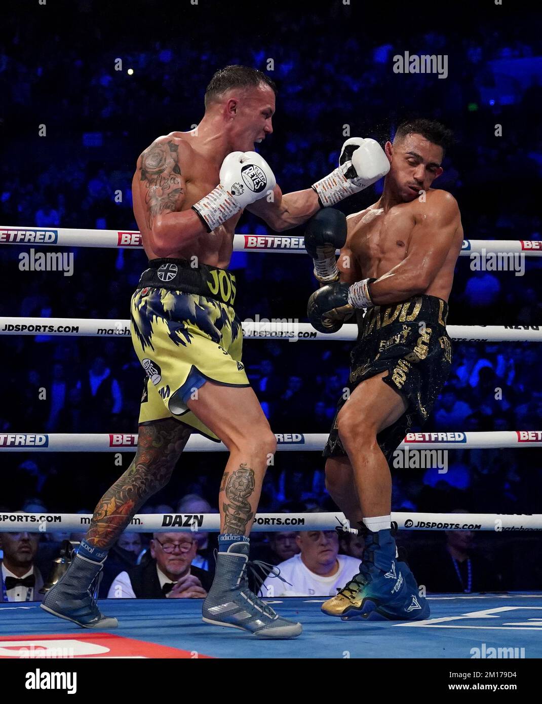Josh Warrington (left) and Luis Alberto Lopez in action in their IBF ...