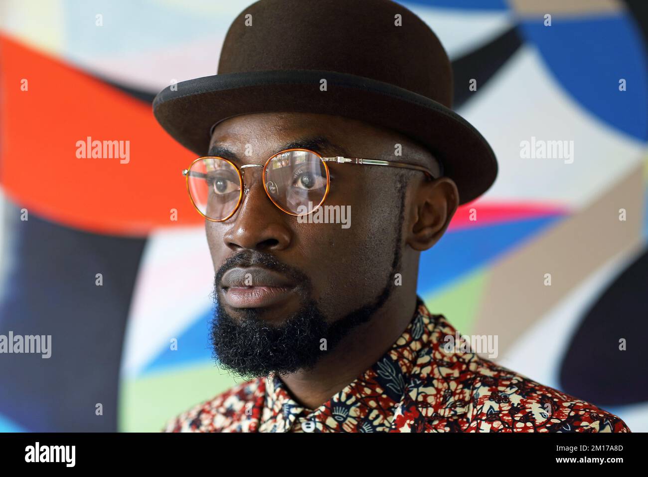 Well dressed black English gentleman with bowler hat Stock Photo - Alamy