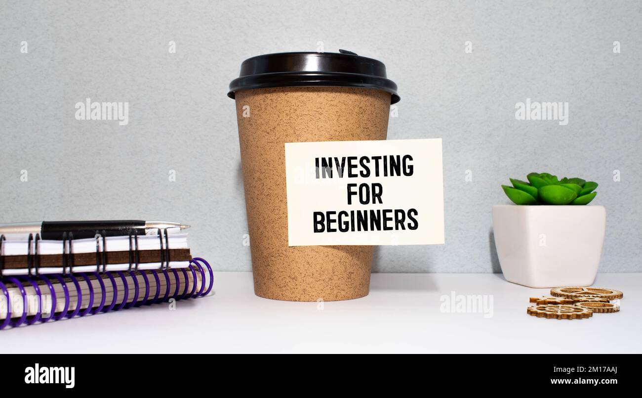 INVESTING FOR BEGINNERS . text on white paper on gray background Stock ...