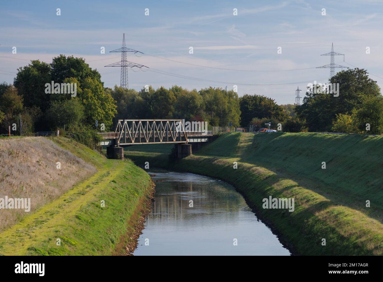 bypass channel for big river with power lines and bridge Stock Photo ...