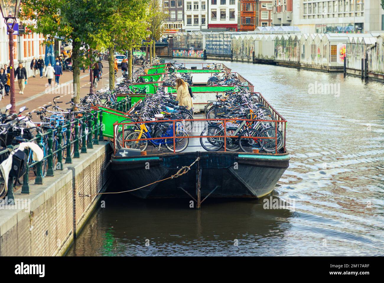 View of canal and Amsterdam's iconic floating Flower Market Stock Photo ...