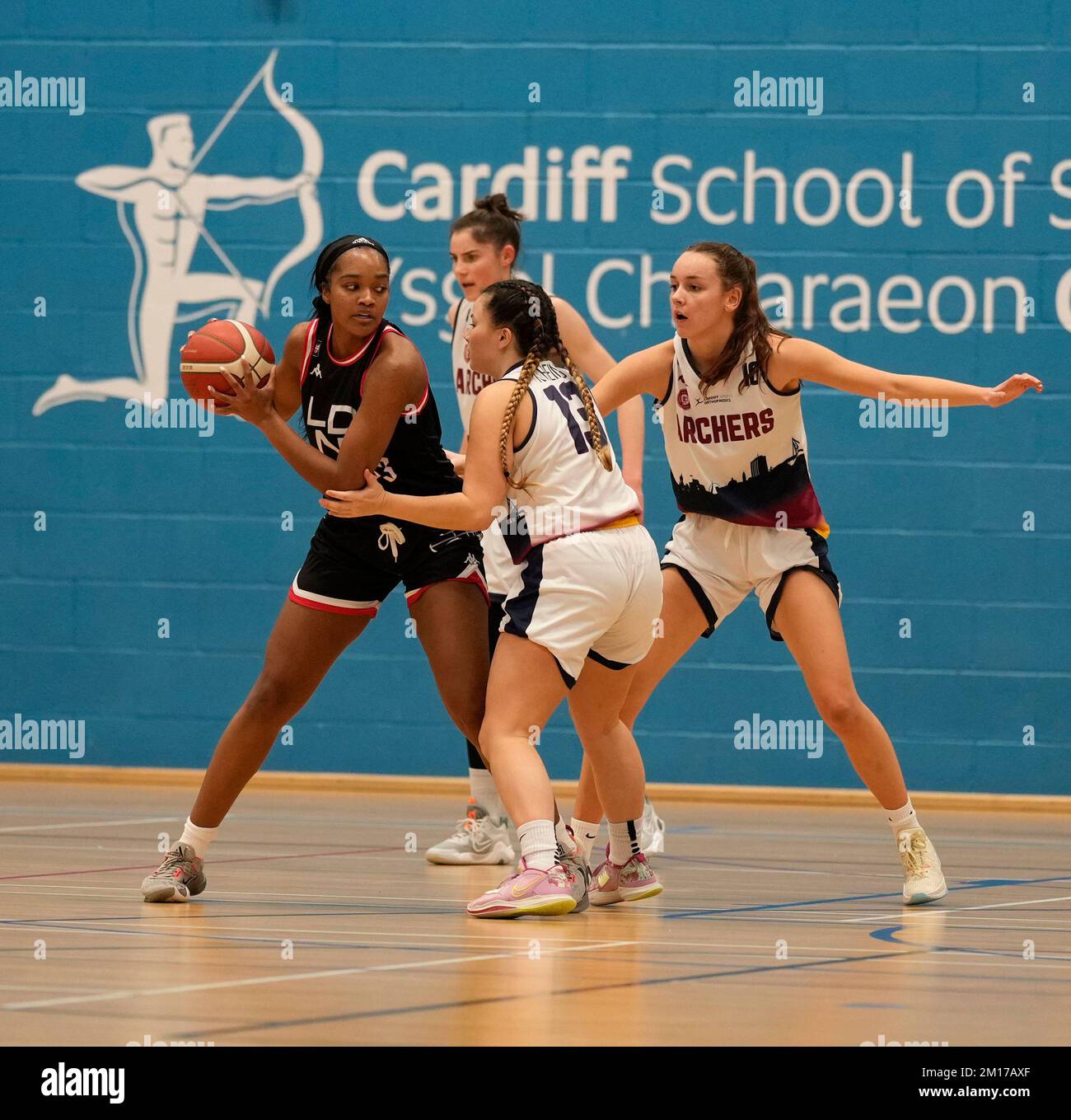 Cardiff, Wales, 10, December, 2022, Ty Battle (Lions) (L) is blocked by ...