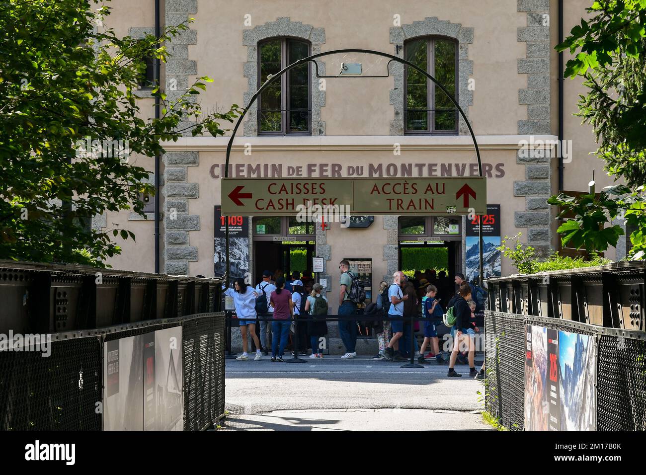Tourists queuing at the ticket office of the rack railway that leads ...