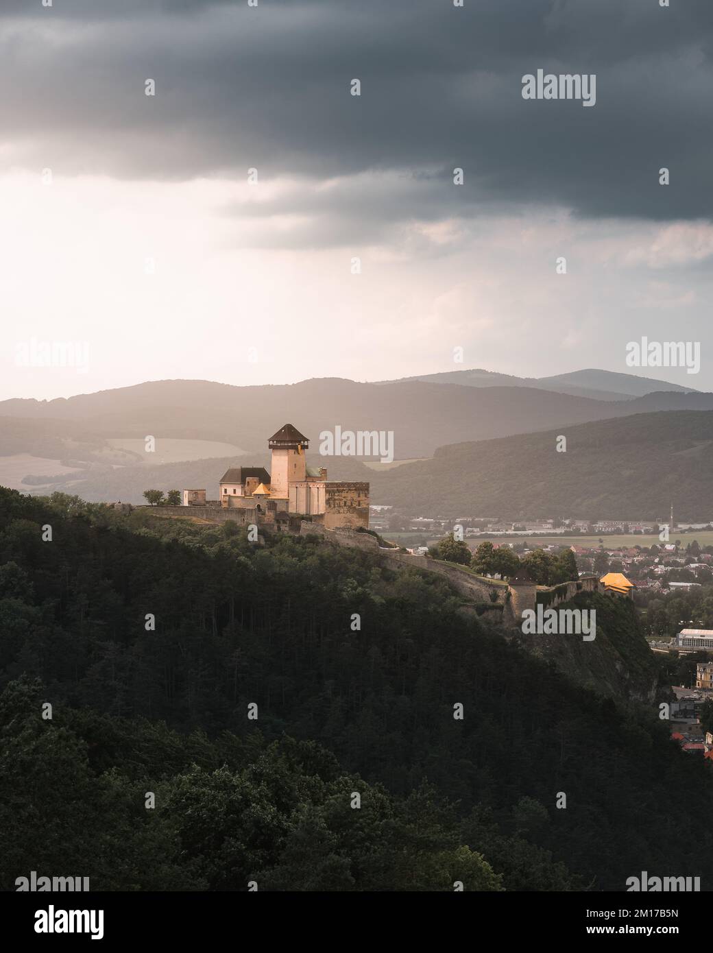 A vertical of Trencin castle looking to the townscape, trees around ...